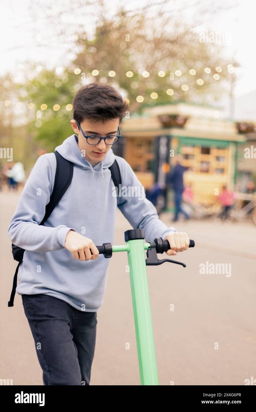 Male rides electric scooter hi-res stock photography and images - Alamy