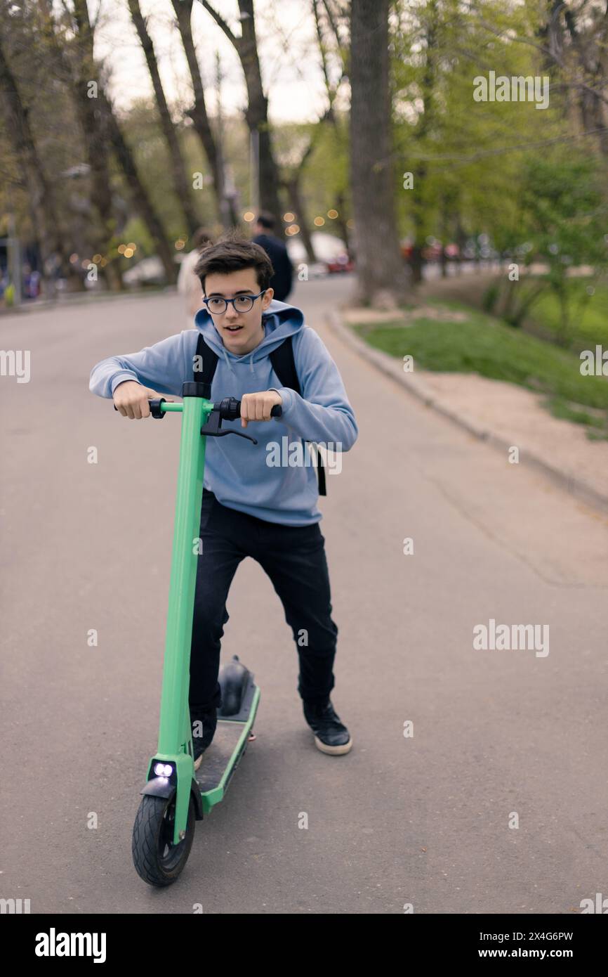 Male rides electric scooter hi-res stock photography and images - Alamy