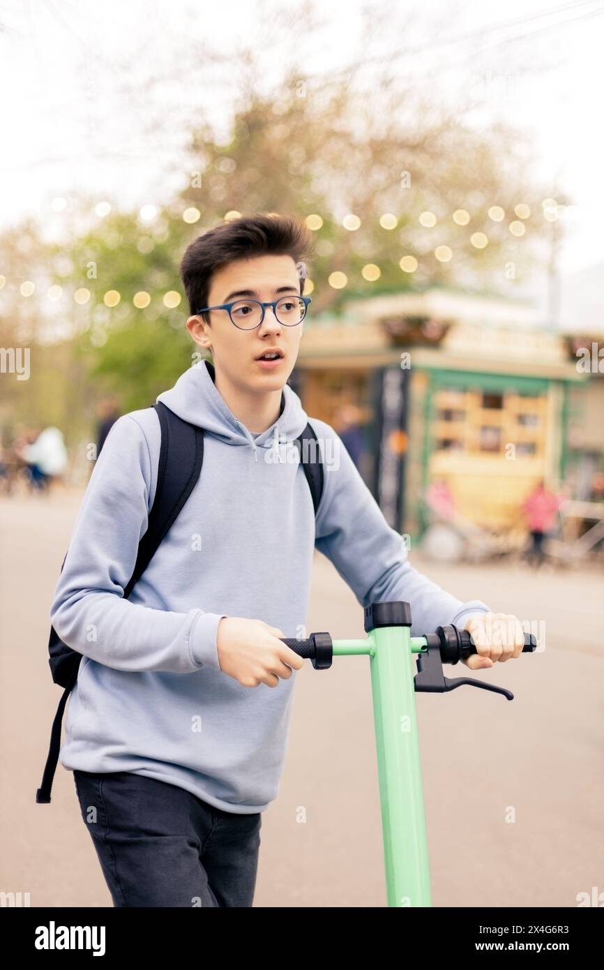 Male rides electric scooter hi-res stock photography and images - Alamy