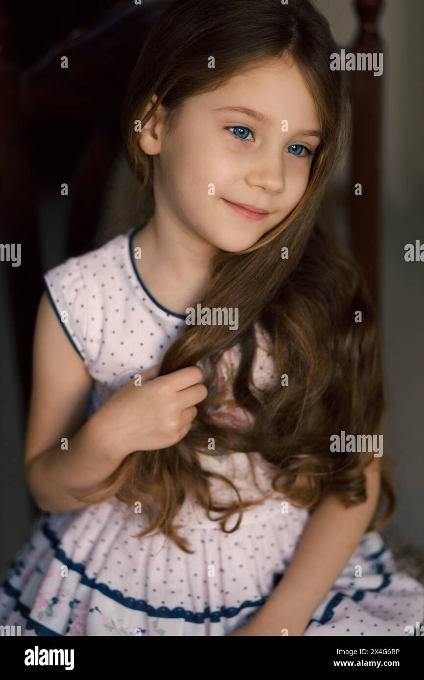 Portrait of little child with long hair Stock Photo - Alamy