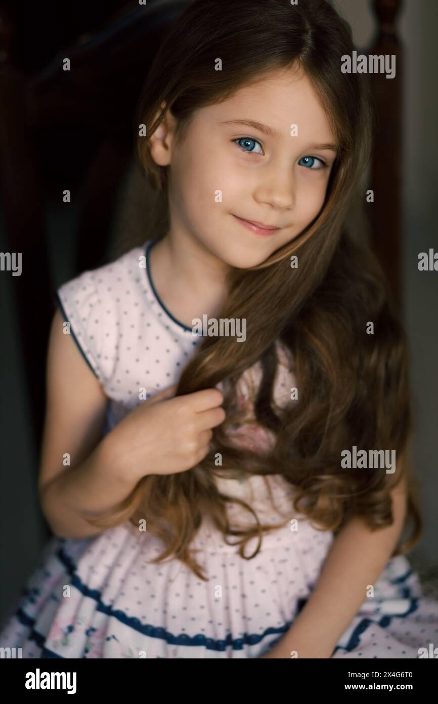 Portrait of little child with long hair Stock Photo - Alamy
