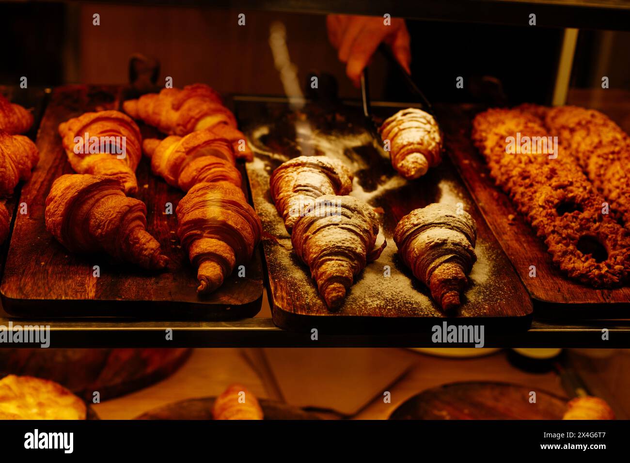 Baked foods on glass display Stock Photo - Alamy