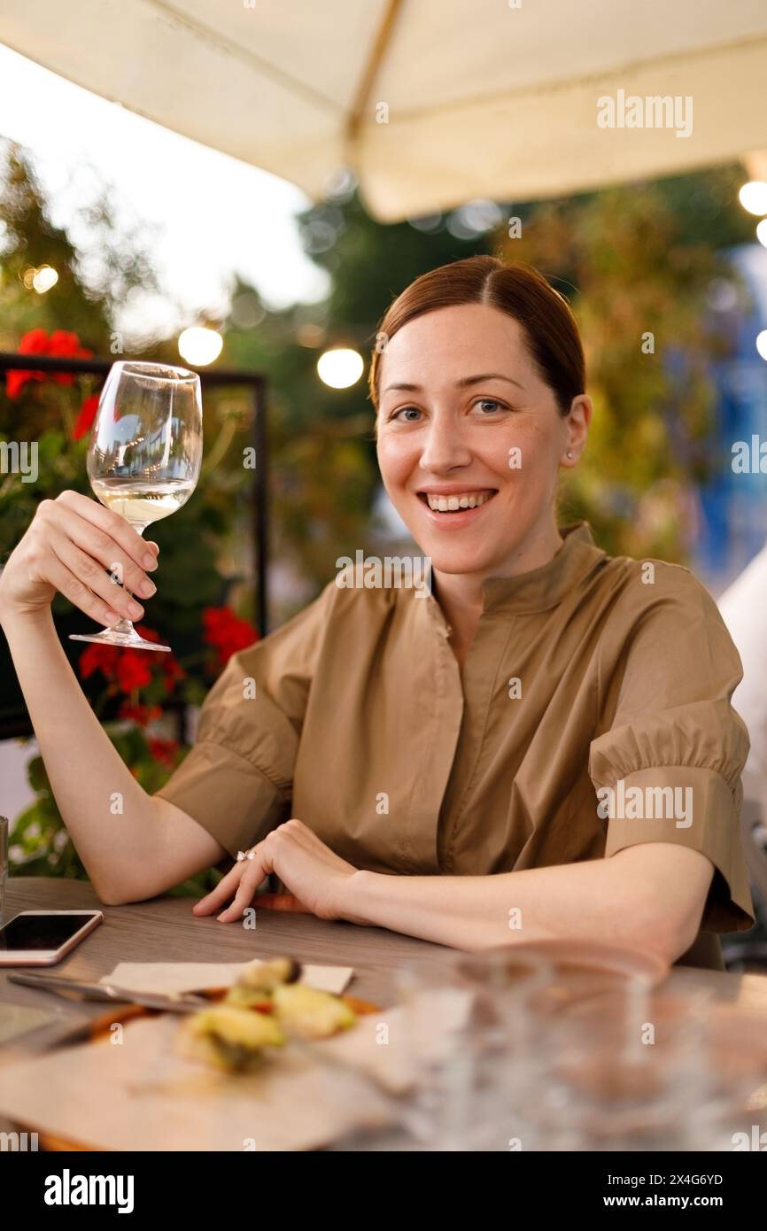Woman glass wine in hand hi-res stock photography and images - Alamy
