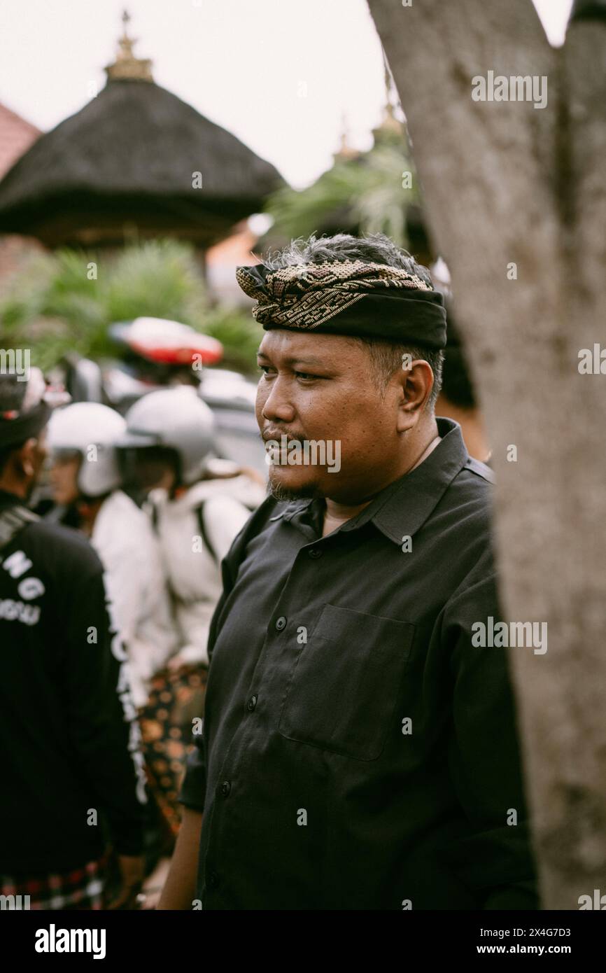 Balinese men in traditional clothes at the ceremony Stock Photo - Alamy