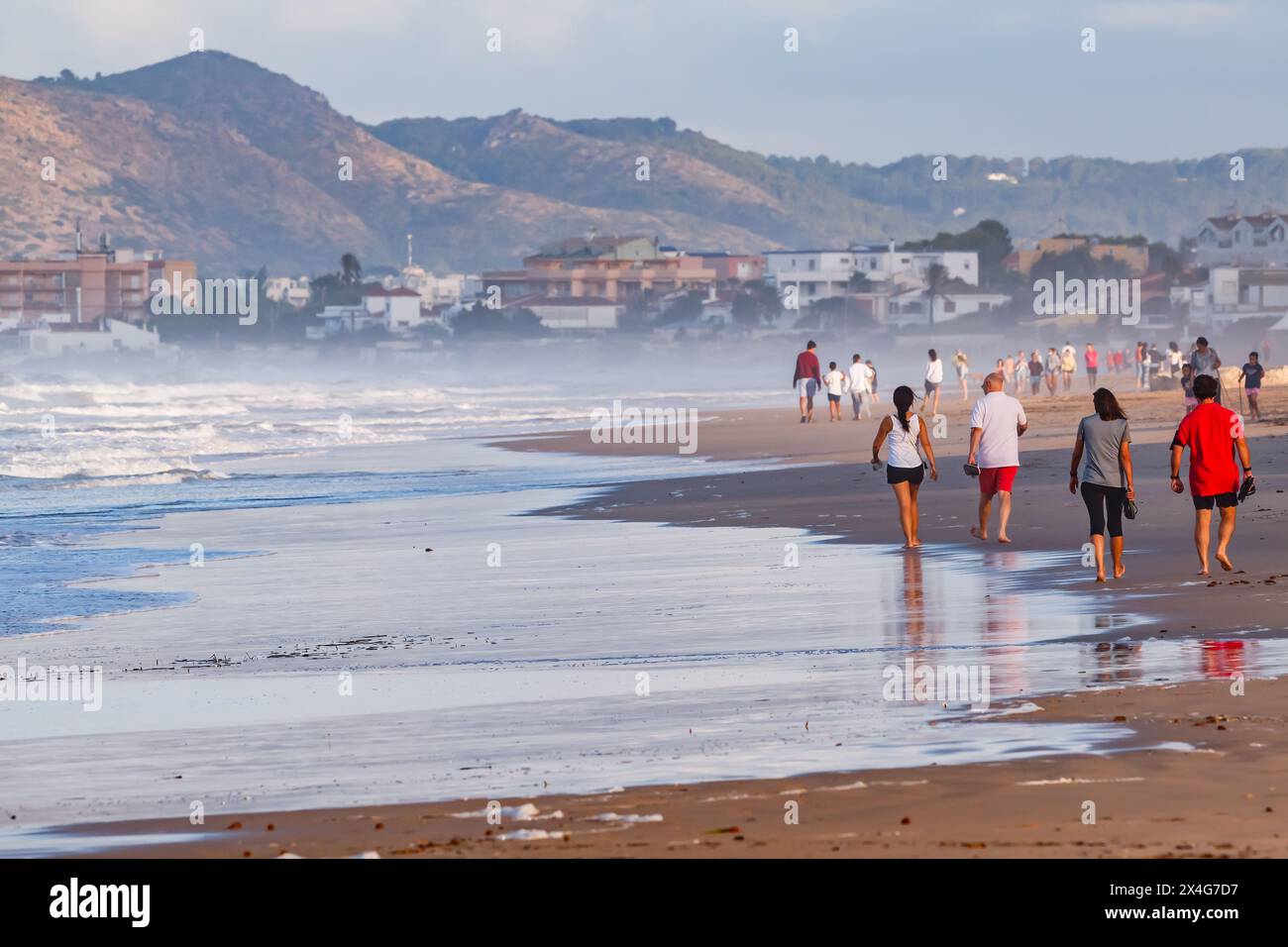 People walking on Les Marines beach, Denia Stock Photo - Alamy