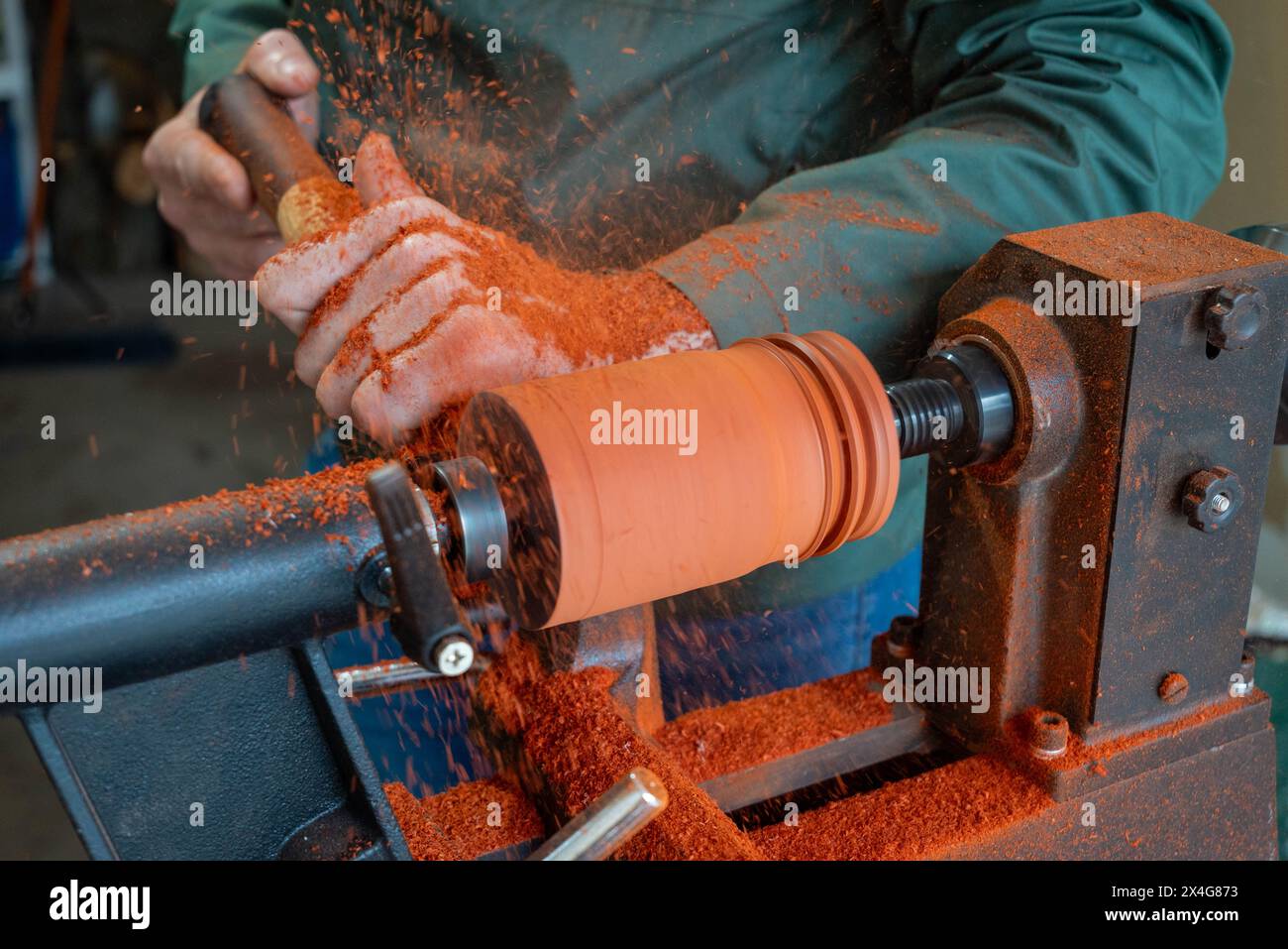 Man Carving wood on a woodworking lathe Stock Photo - Alamy
