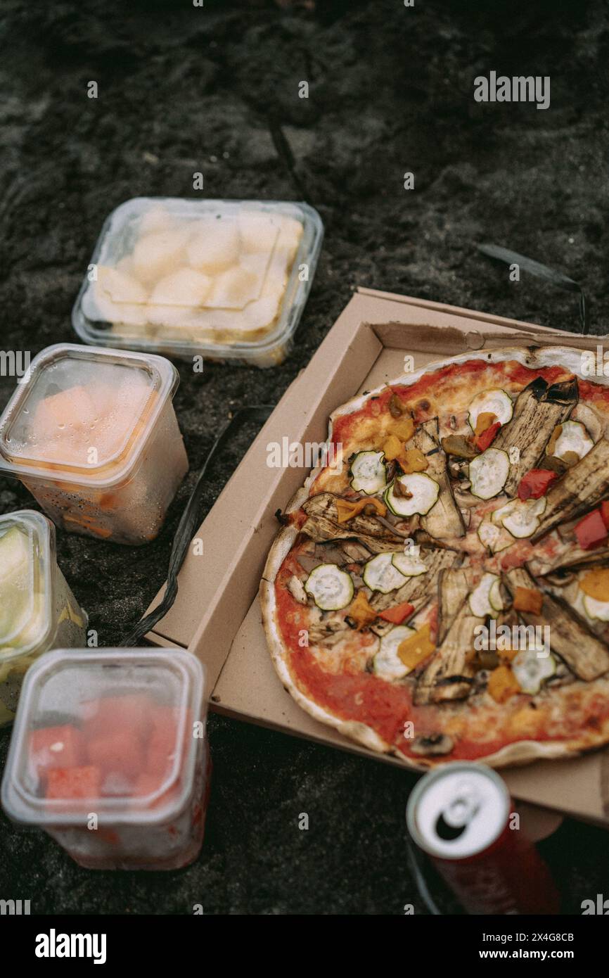 Picnic on the beach, pizza and fruit Stock Photo - Alamy