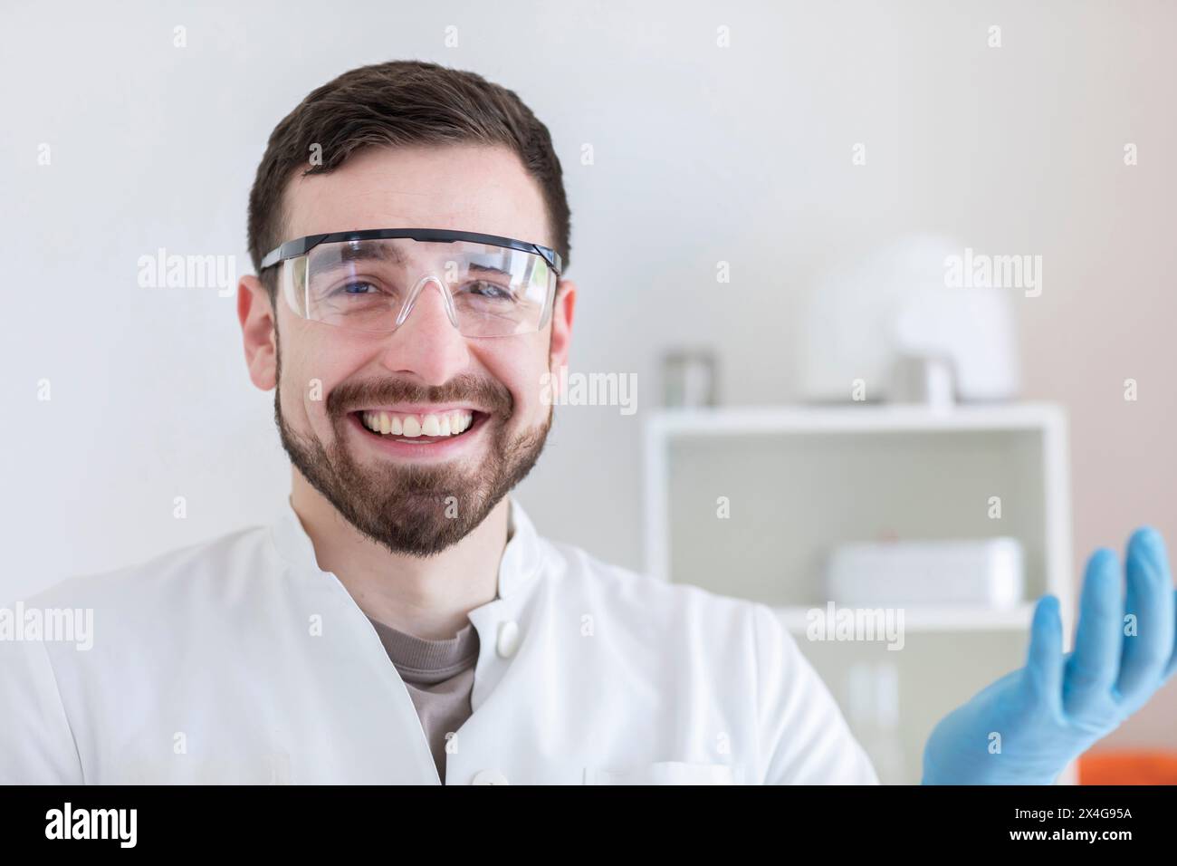 Scientist male with lab glasses working in a laboratory Stock Photo - Alamy
