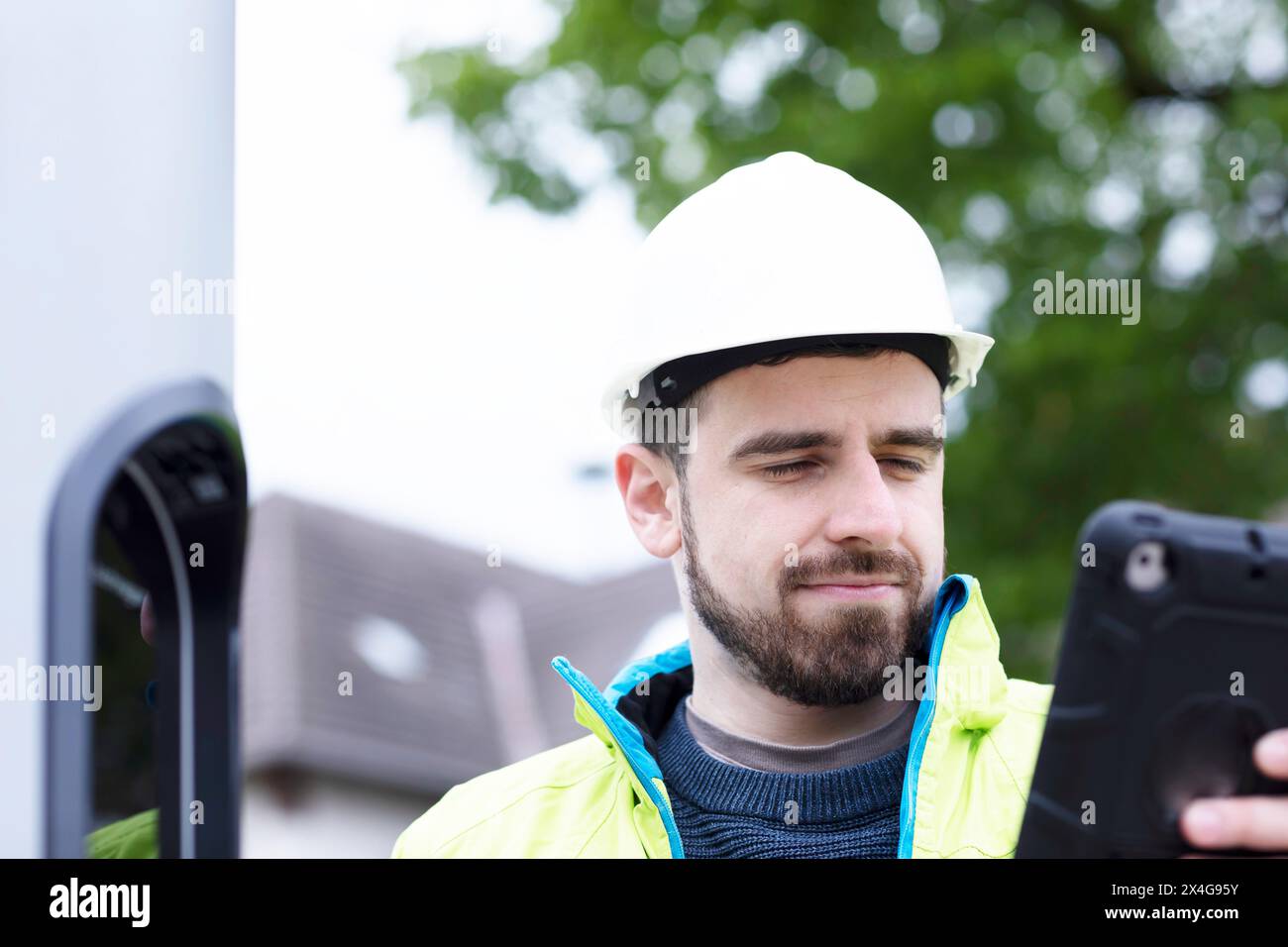 engineer male with helmet and beard controlling protocol Stock Photo ...