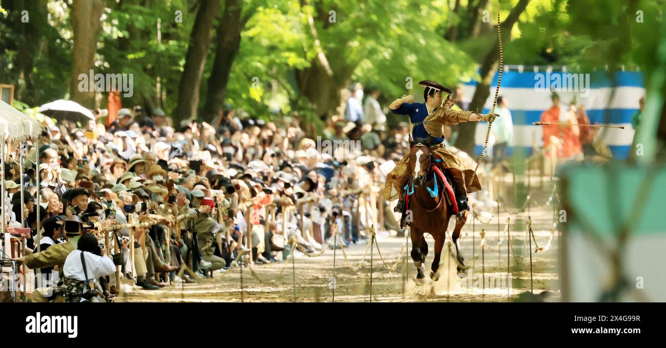 An archer releases an arrow during the Yabusame-shinji, a ritual of ...