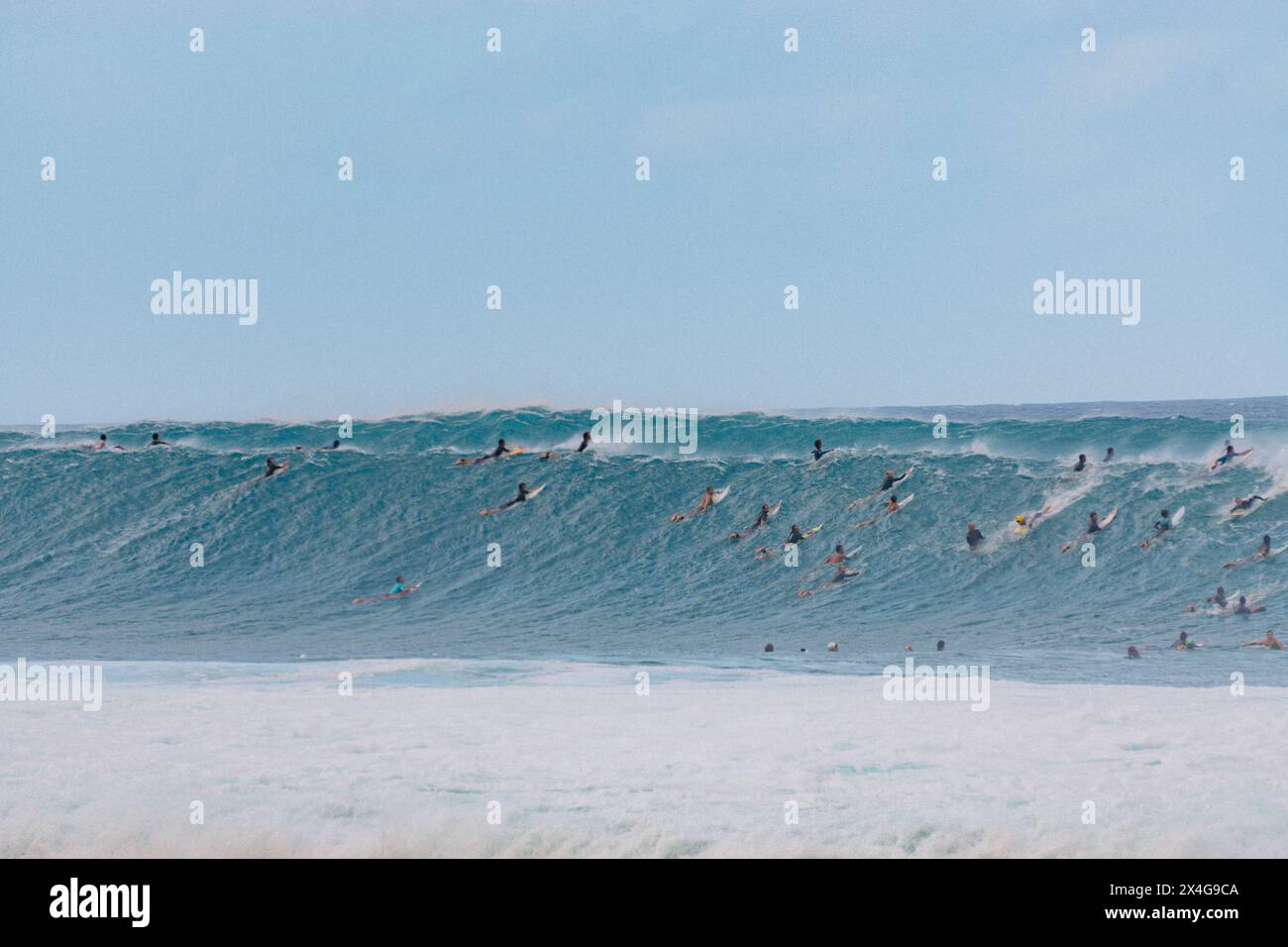 Large crowd of surfers paddling out during big set at Pipeline Stock ...