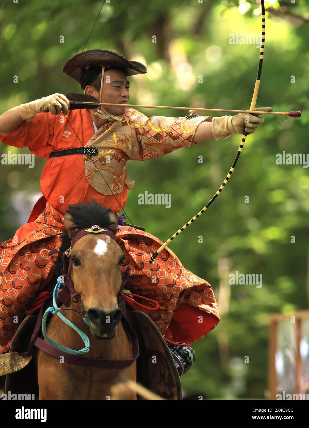 An archer releases an arrow during the Yabusame-shinji, a ritual of ...