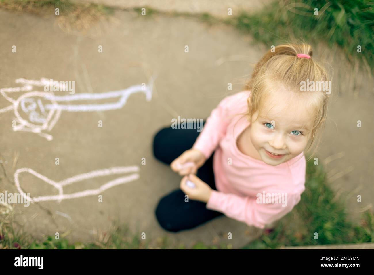 Little child playing with chalk Stock Photo - Alamy
