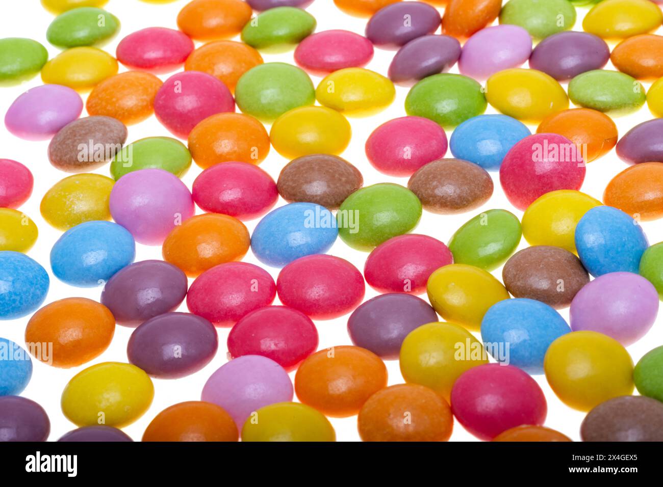 chocolate colored buttons isolated on white background Stock Photo - Alamy