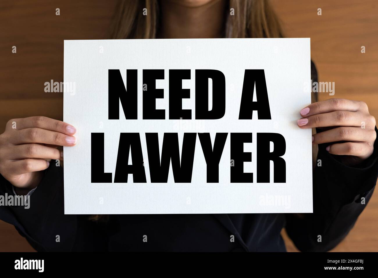 Need a Lawyer Need a lawyer. Woman with white page, black letters ...