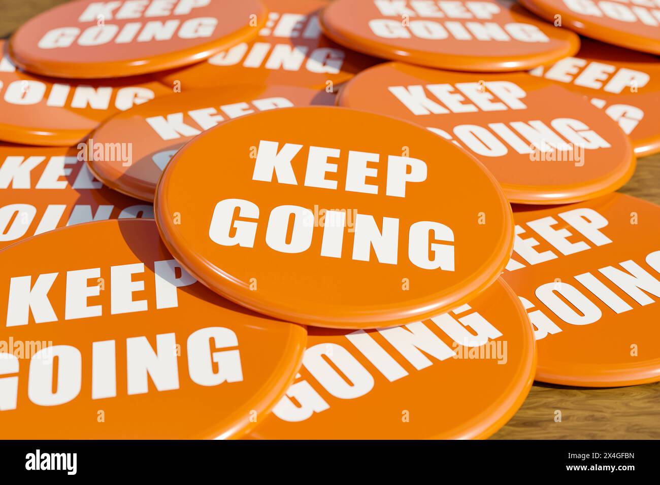 Keep going. Keep going. Orange badges laying on the table with the ...