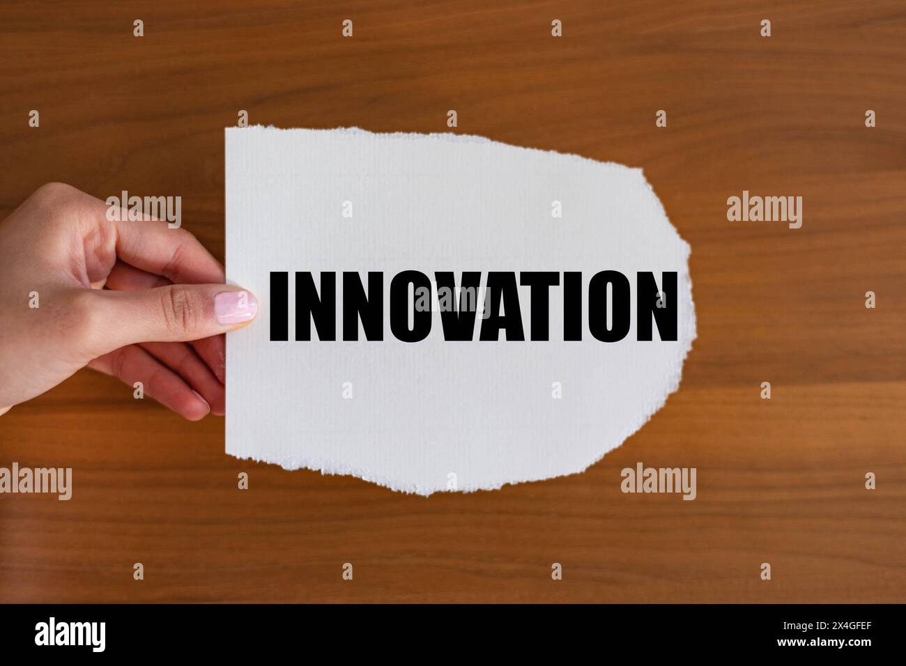 Innovation Innovation. Woman hand holds a piece of paper with a note ...