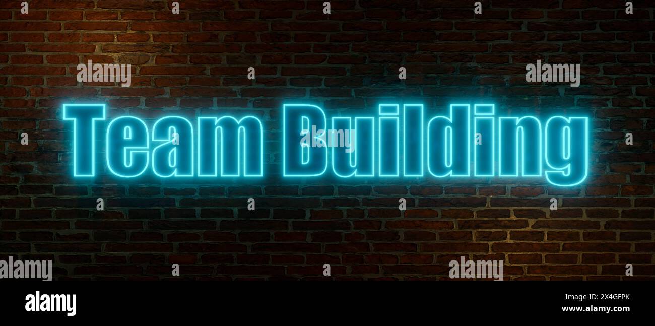 Team building. Team building. Brick wall at night with the text team ...