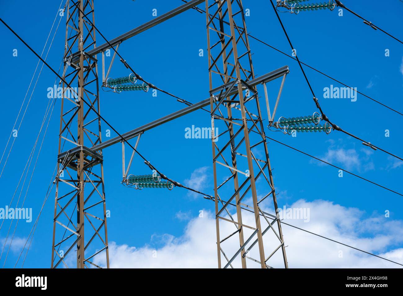 Isolators and power lines of a high voltage mast Stock Photo - Alamy
