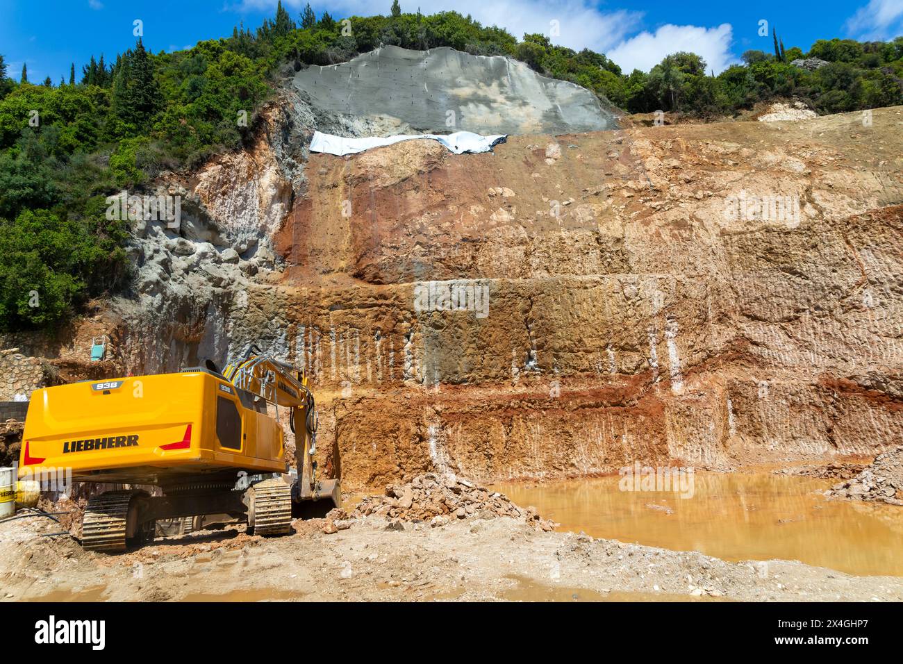 Liebherr excavator at hillside construction site for new tourist ...
