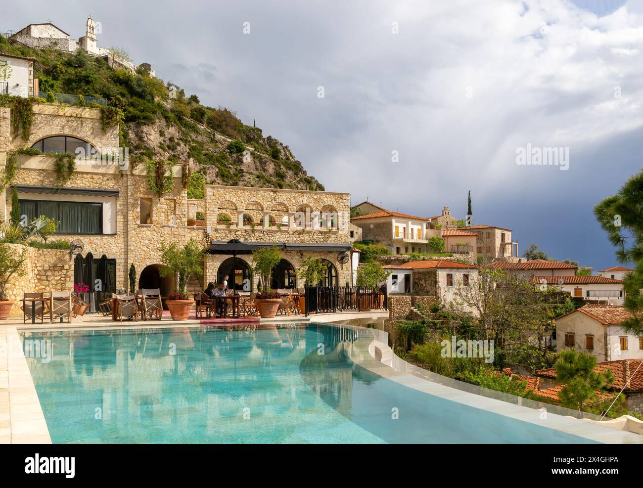Swimming pool and converted village buildings at Zoe Hora luxury hotel ...