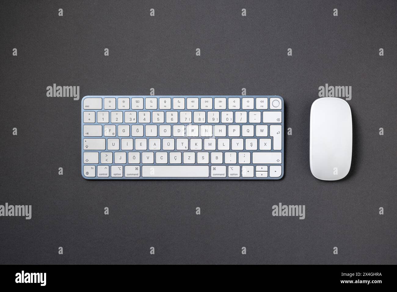 Top view of wireless keyboard and mouse on dark gray work desk Stock ...