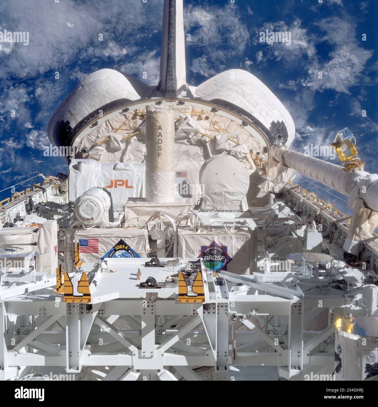 Cargo bay with open doors of the Space Shuttle Columbia in 1997 with a ...