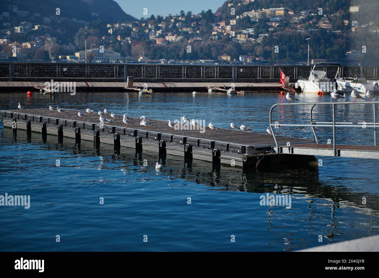 Beautiful alpine nature, mountains background with boats moored in Lake ...