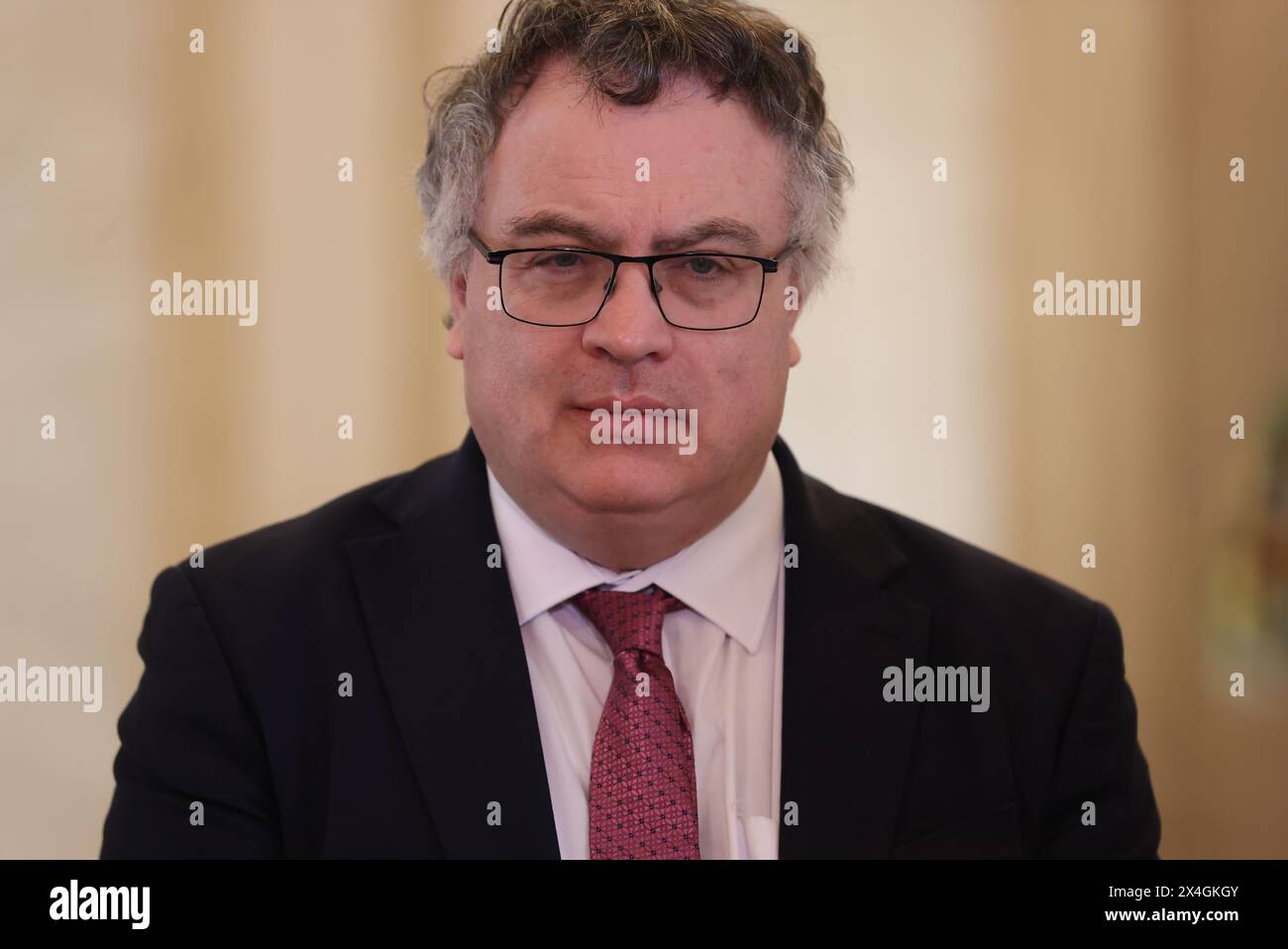Alliance party MP Stephen Farry, listening to party leader Naomi Long ...
