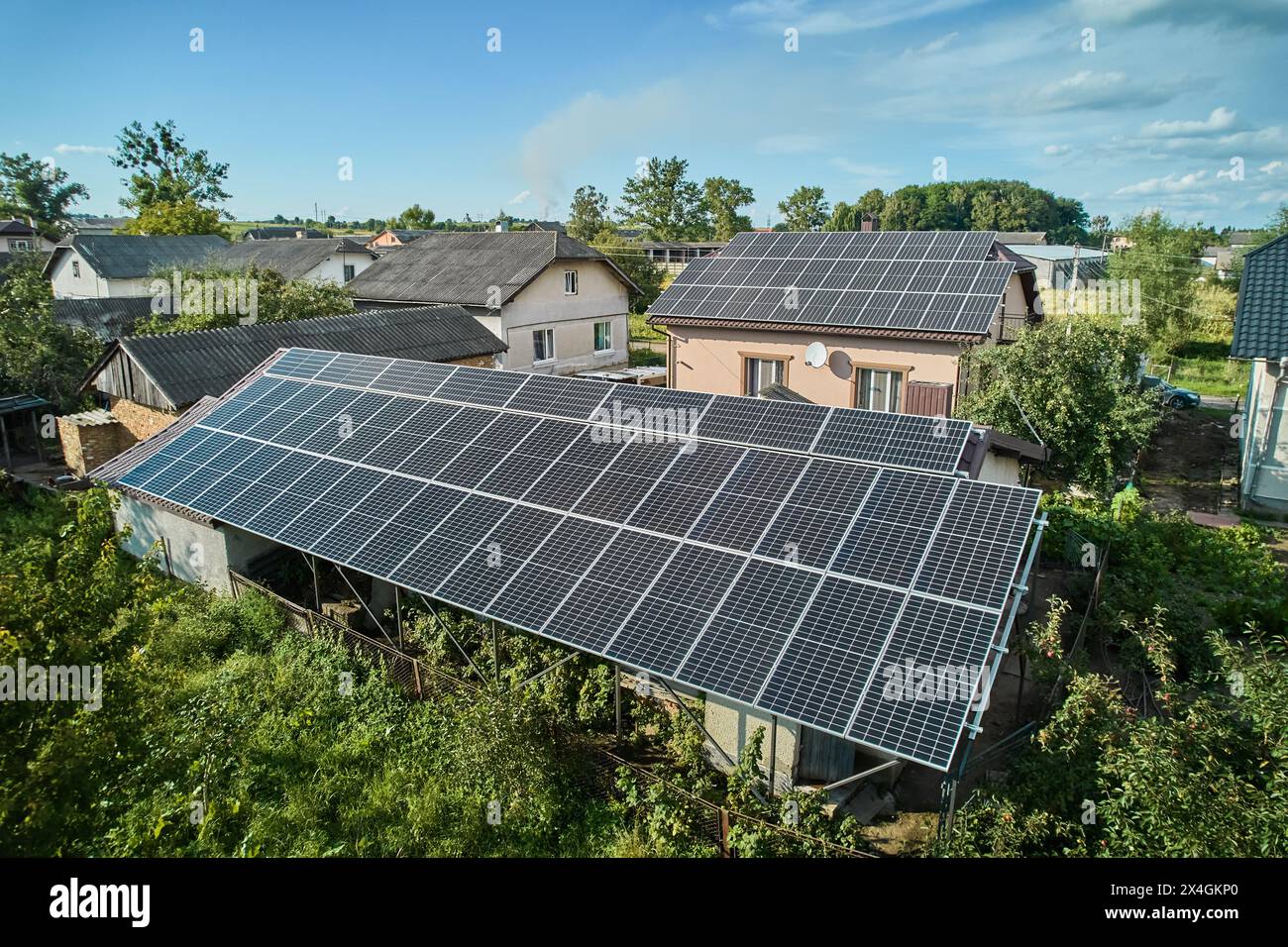 Aerial top view of new modern house cottage with solar photovoltaic ...