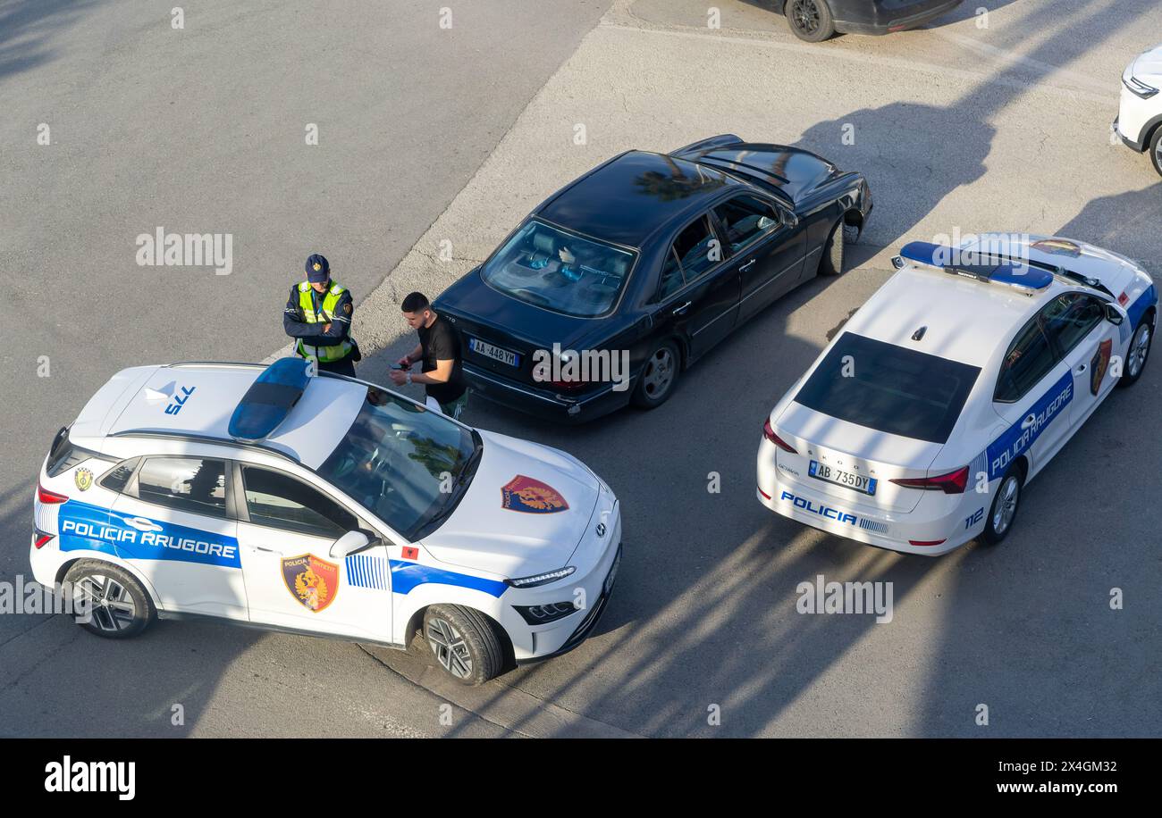 Looking down of Traffic police checking a vehicle, Mother Theresa Rinas ...