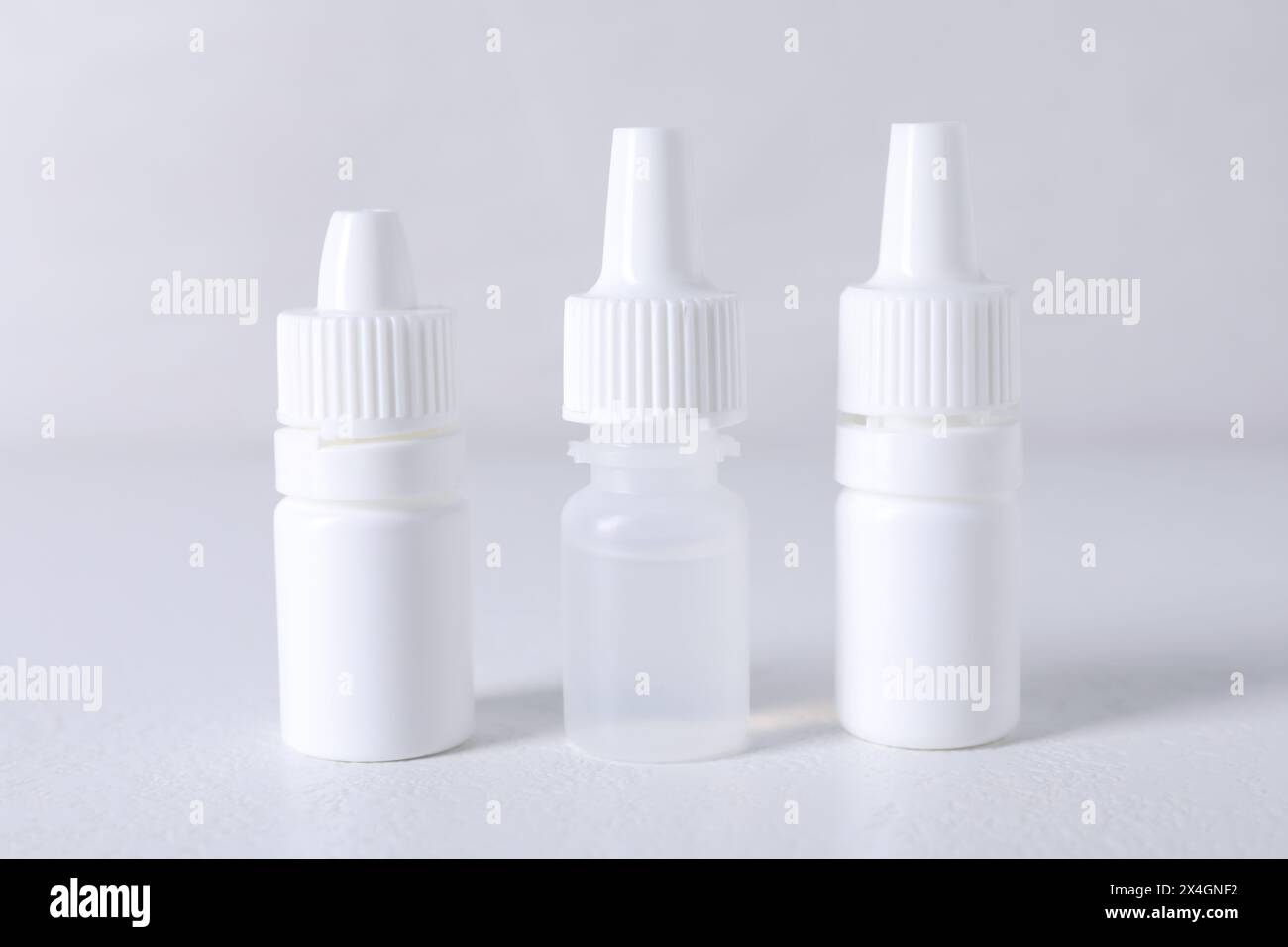 Bottles of medical drops on white background Stock Photo - Alamy