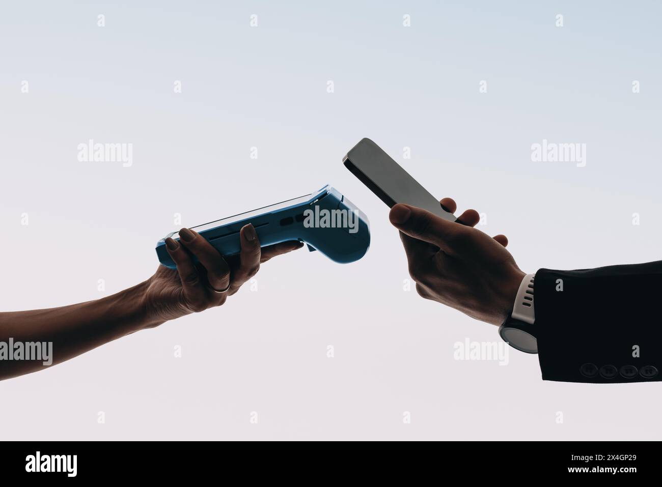 Electronic device held by hands on background studio. Hands scan bill ...