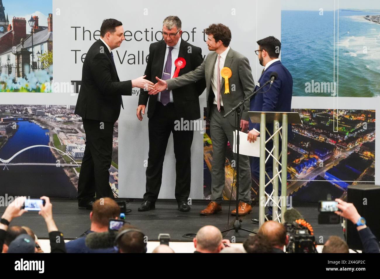 Conservative party candidate Lord Ben Houchen (left) shakes hands with ...