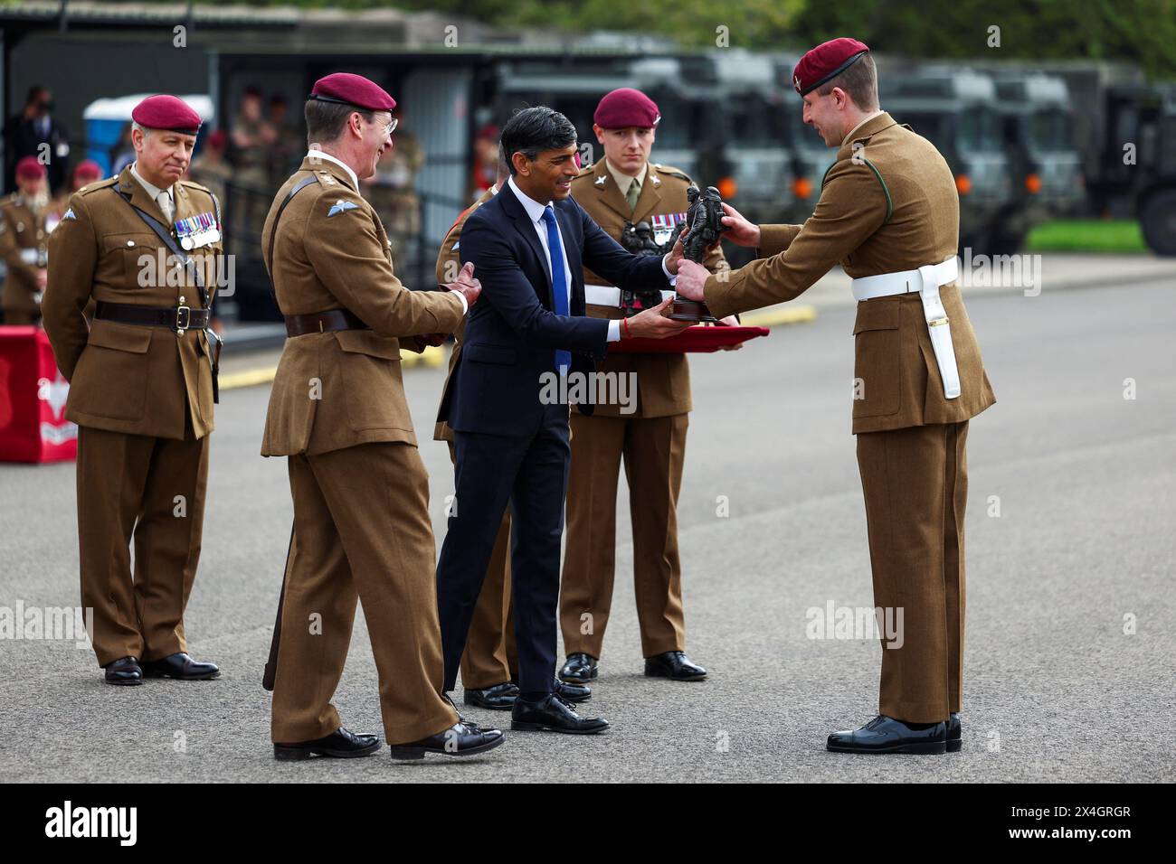 Prime Minister Rishi Sunak presents an award to a member of the ...