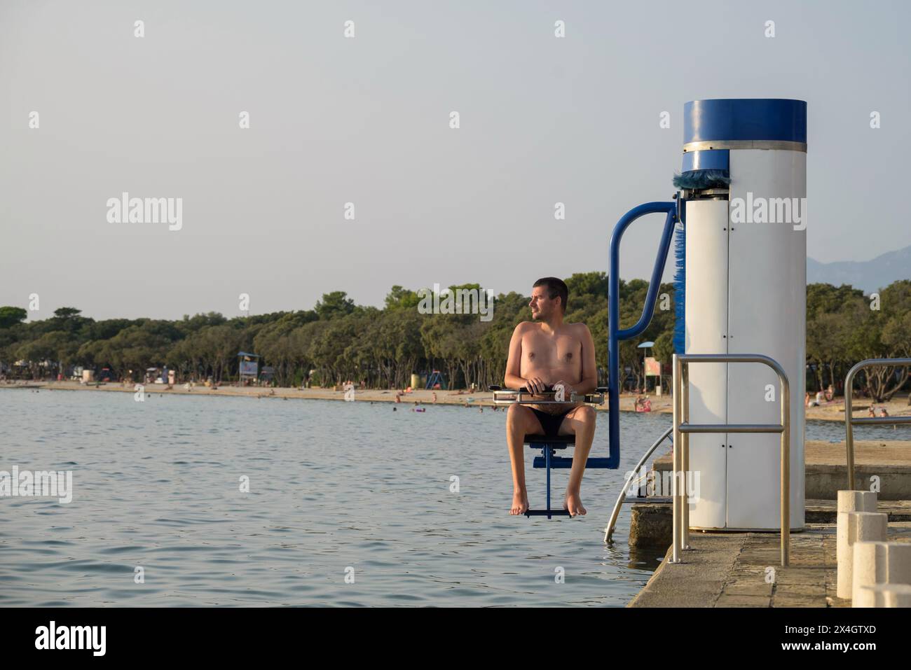Swimming lift at sea for people with disability. Accessible beach and ...