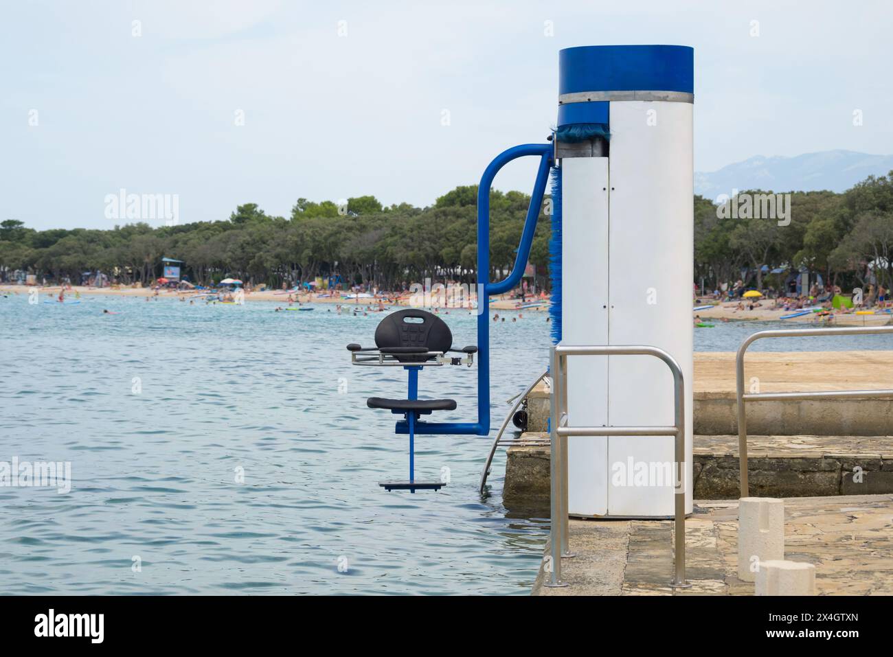 Swimming lift at sea for people with disability. Accessible beach and ...