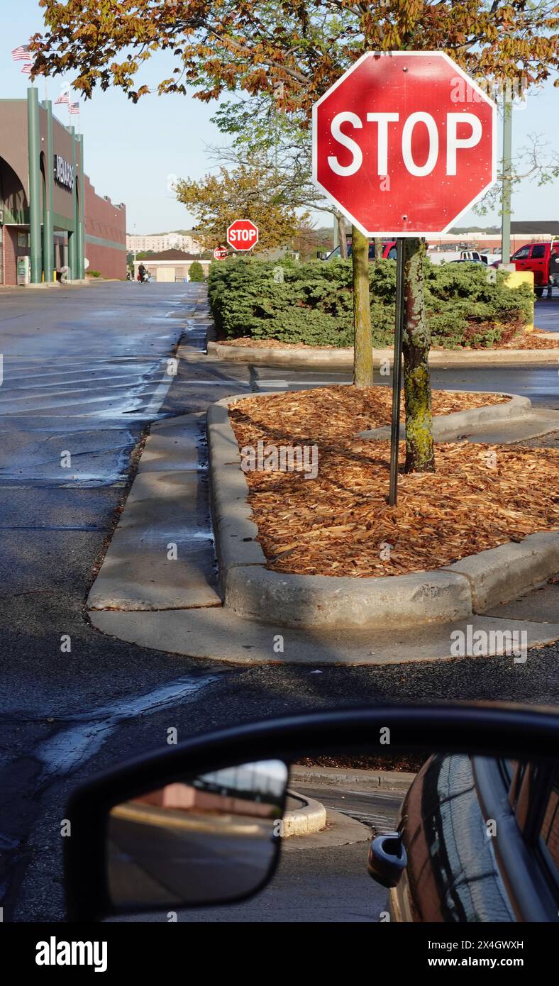 multiple stop signs- common to parking areas of local stores Stock ...