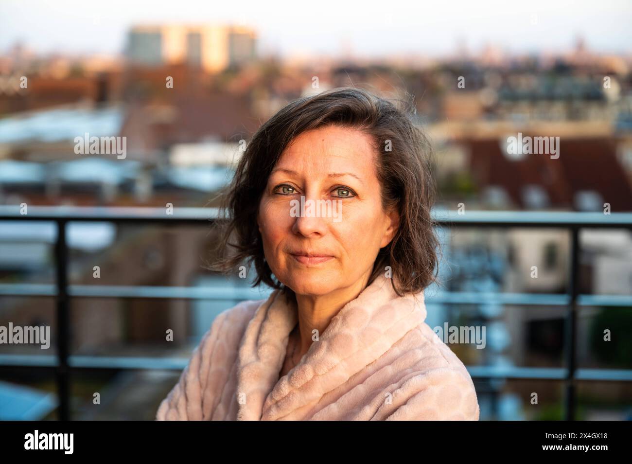 Portrait of a 50 yo woman with a city background, Brussels, Belgium ...