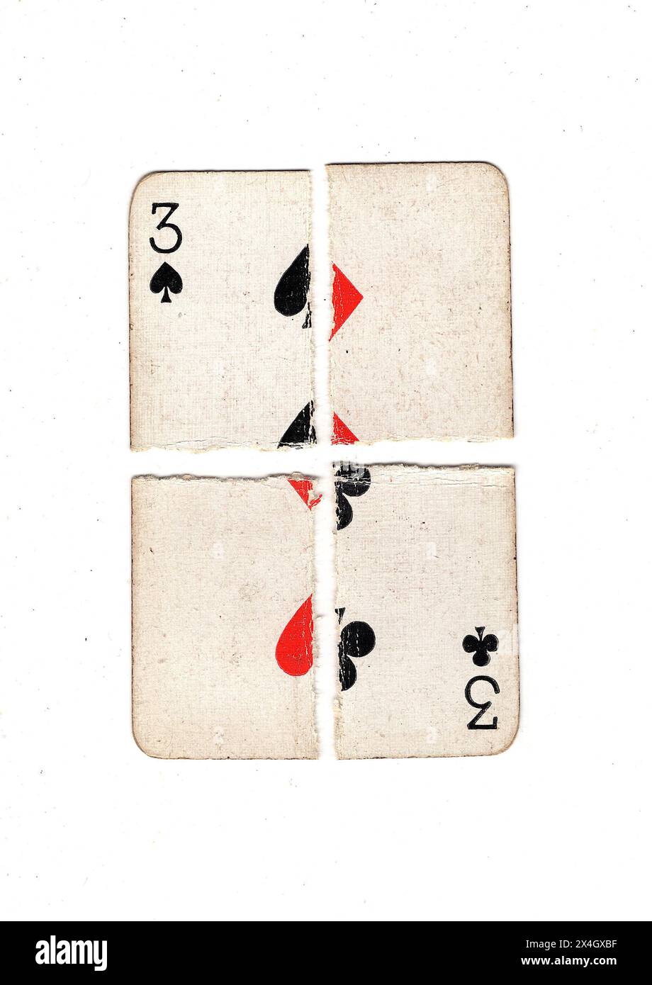 A vintage three playing card made up of torn quarters from four suits ...
