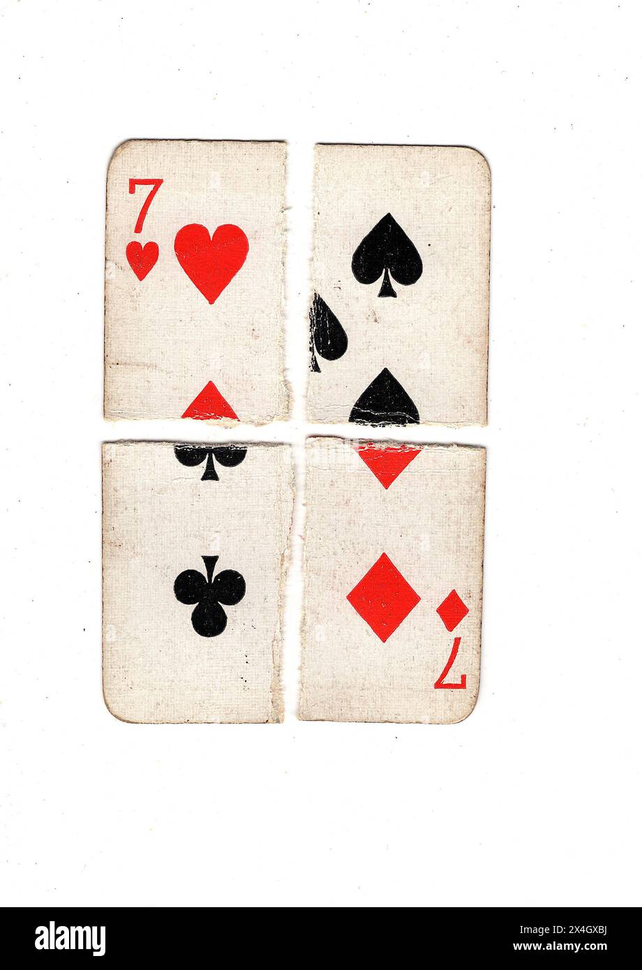 A vintage seven playing card made up of torn quarters from four suits ...