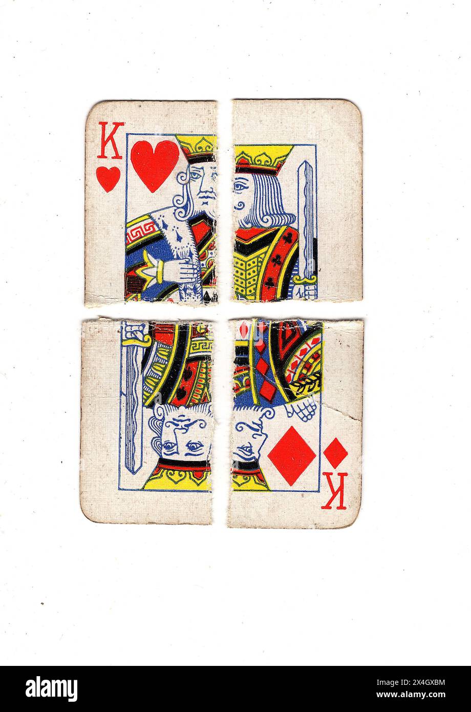 A vintage king playing card made up of torn quarters from four suits on ...