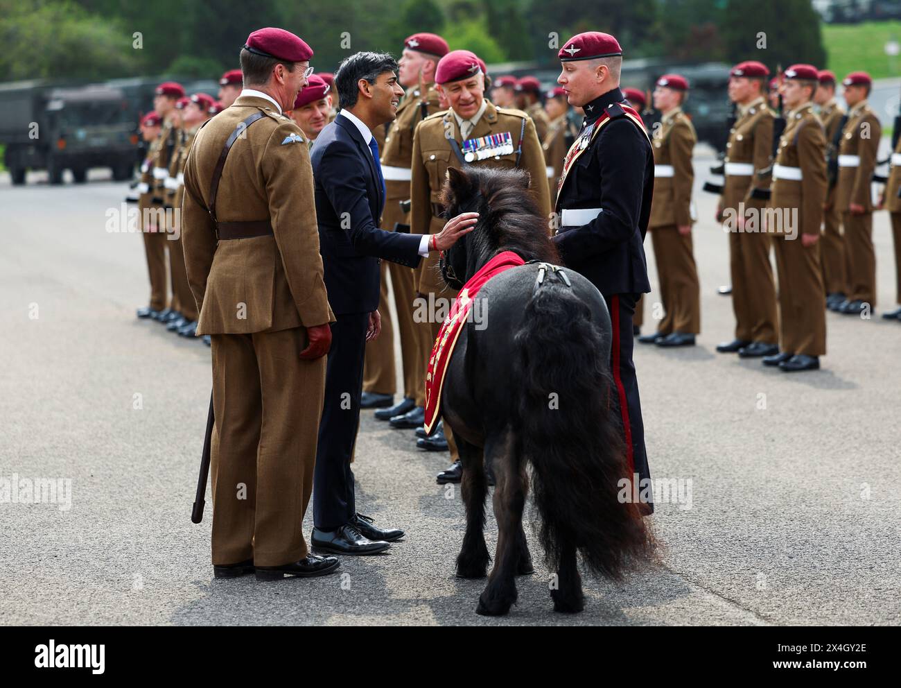 Prime Minister Rishi Sunak pets "Pegasus V", a Shetland pony, as he ...