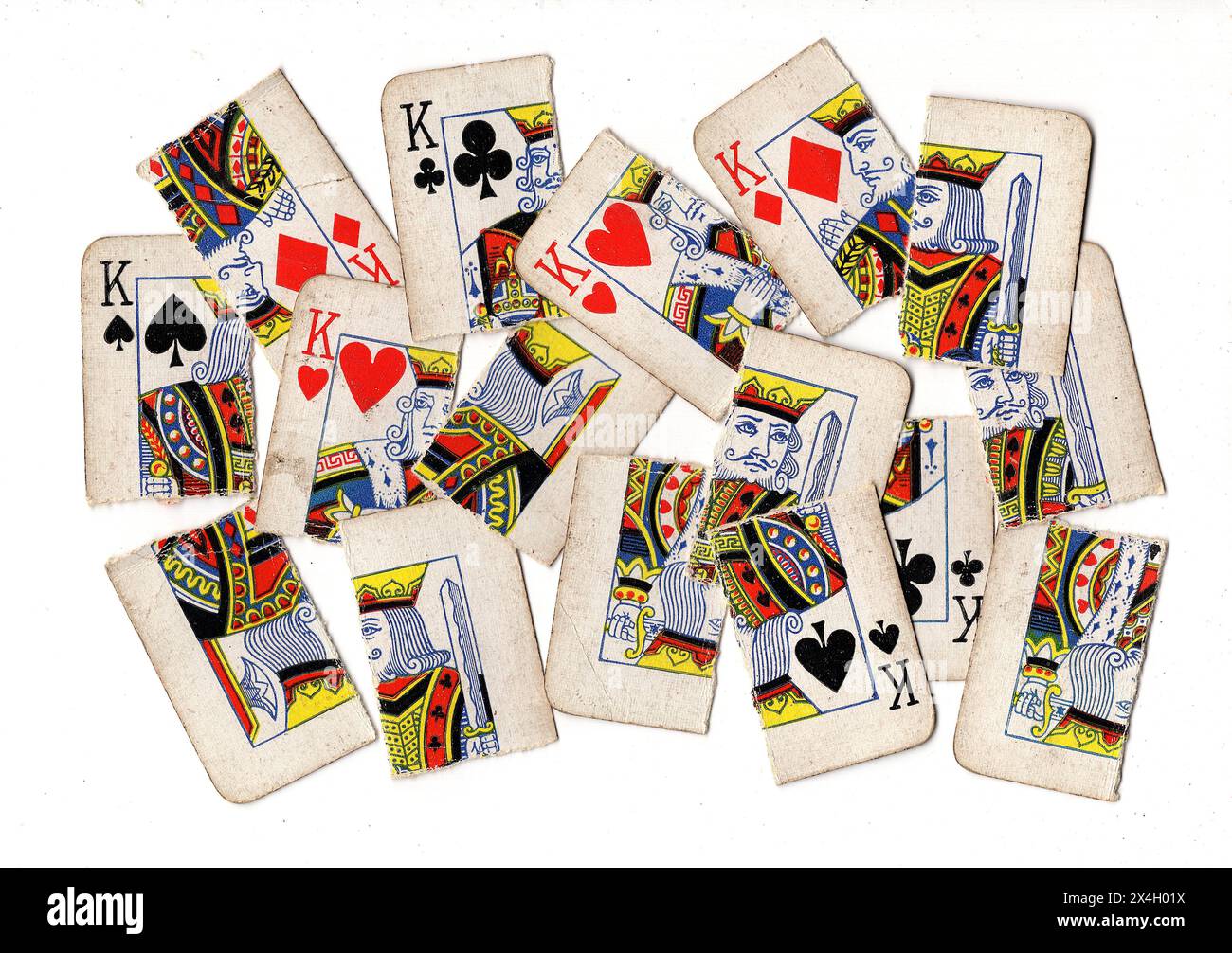 A montage of playing cards featuring kings torn into quarters on a ...
