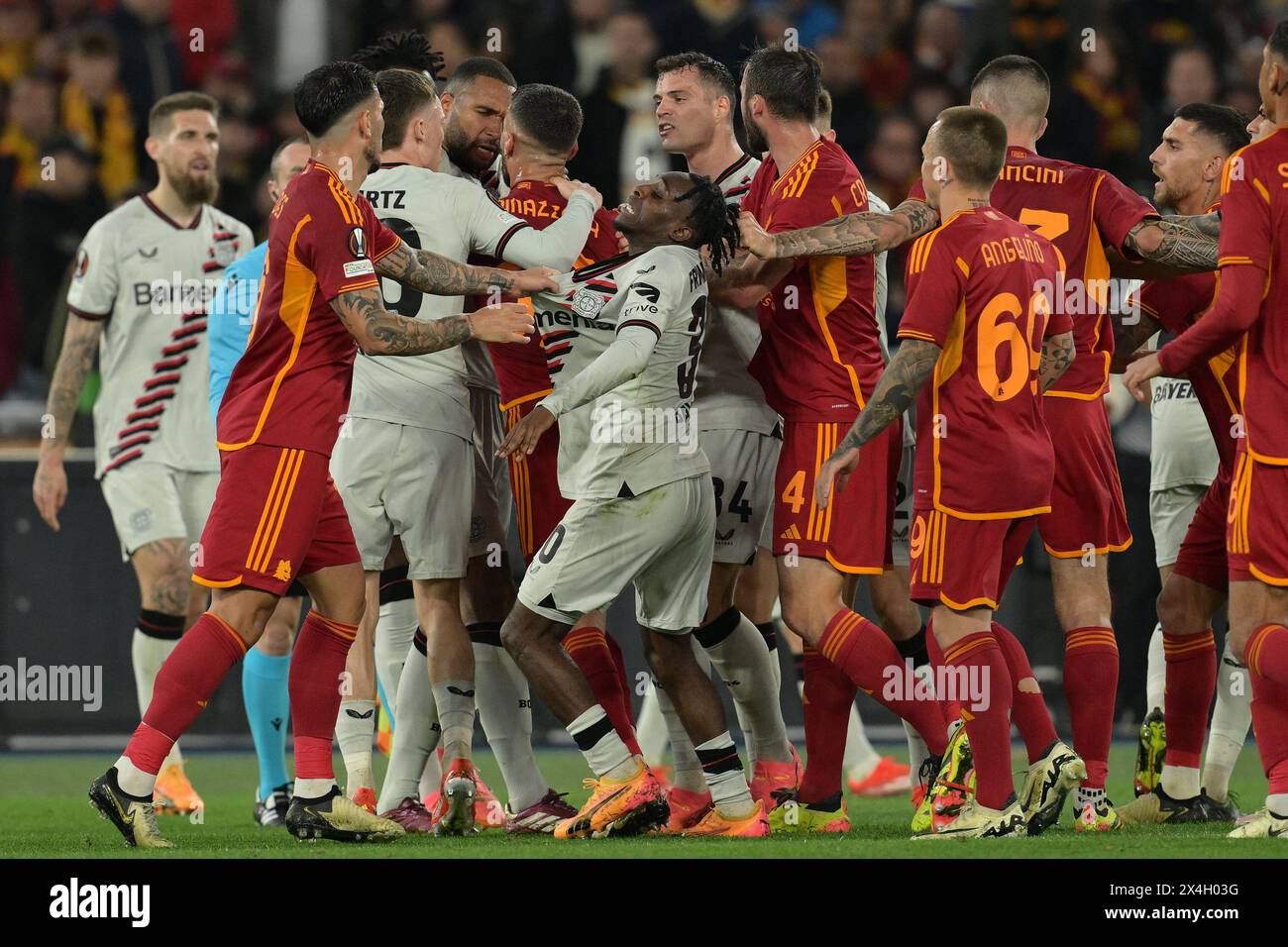 Roma footballer Gianluca Mancini pulls the hair of Bayern Leverkusen ...