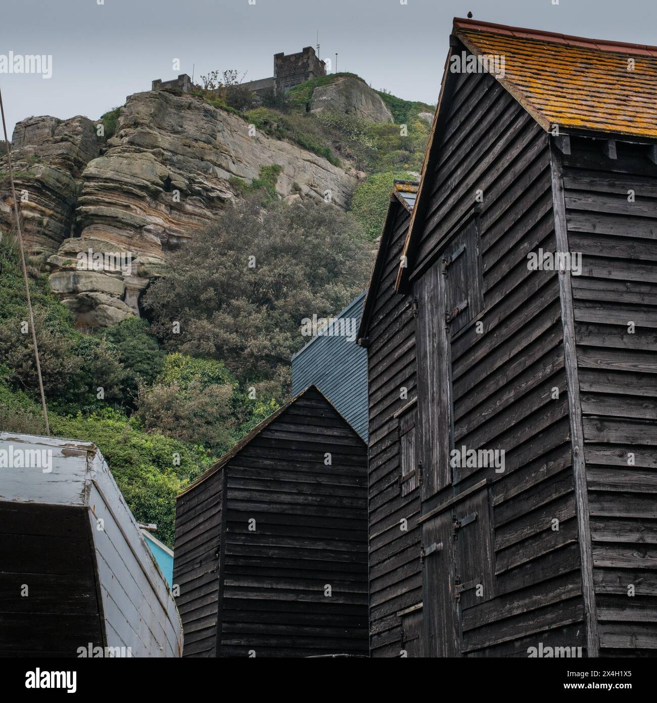 Net huts at Hastings with cliff and East Cliff lift station behind ...