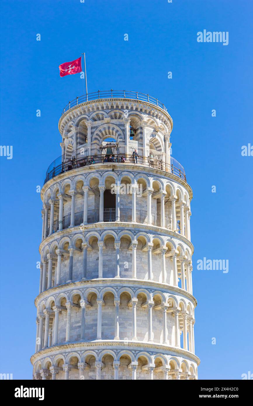 Traditional Pisan Cross flag on top of the leaning tower in Pisa, Italy ...