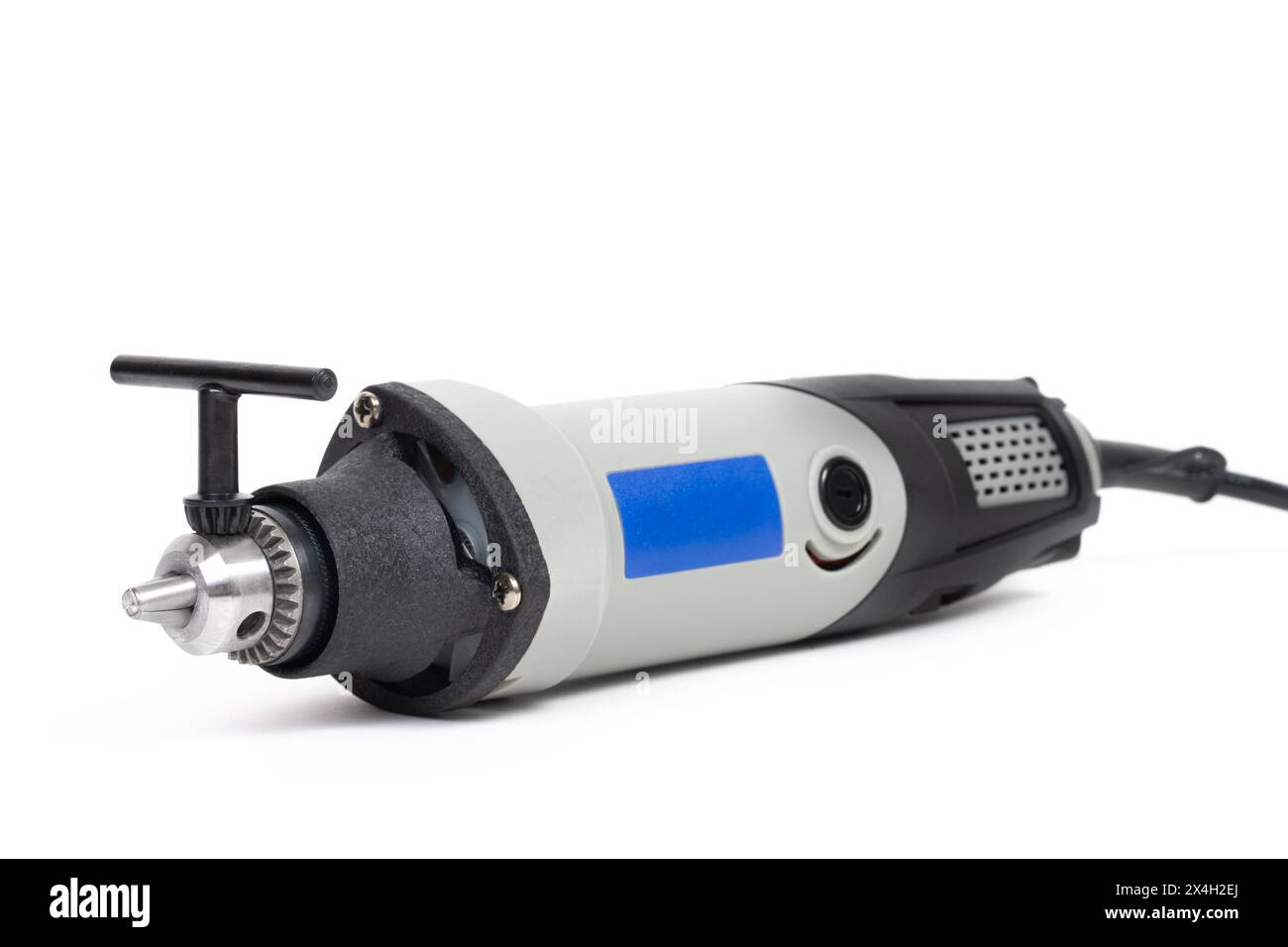 Compact electric drill featuring a key inserted into the chuck. Bit ...