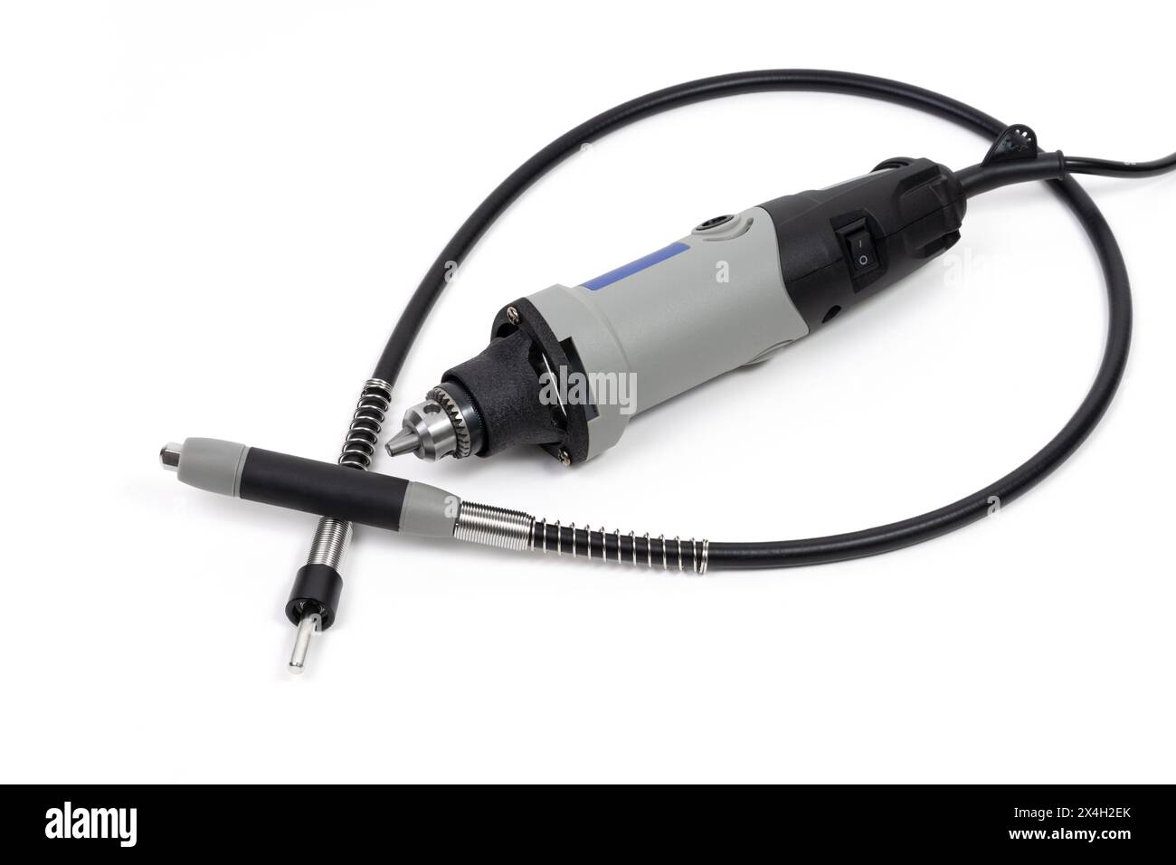 Close-up view of a compact rotary tool equipped with a flexible shaft ...