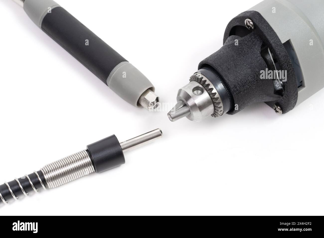 Mini drill chuck and flexible shaft parts close-up isolated on white ...